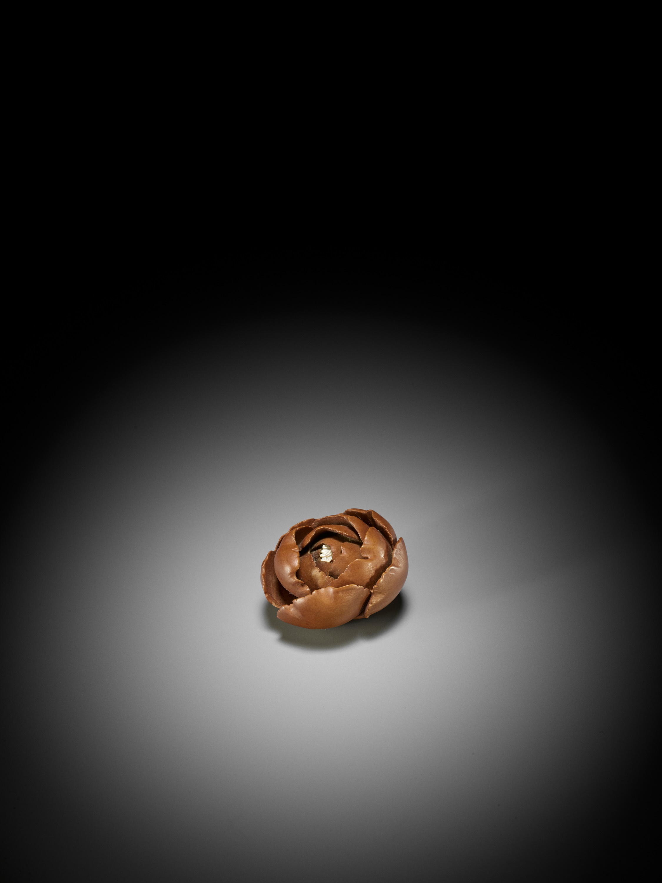 Lot 265 - SHUBI: A WOOD NETSUKE OF A PEONY