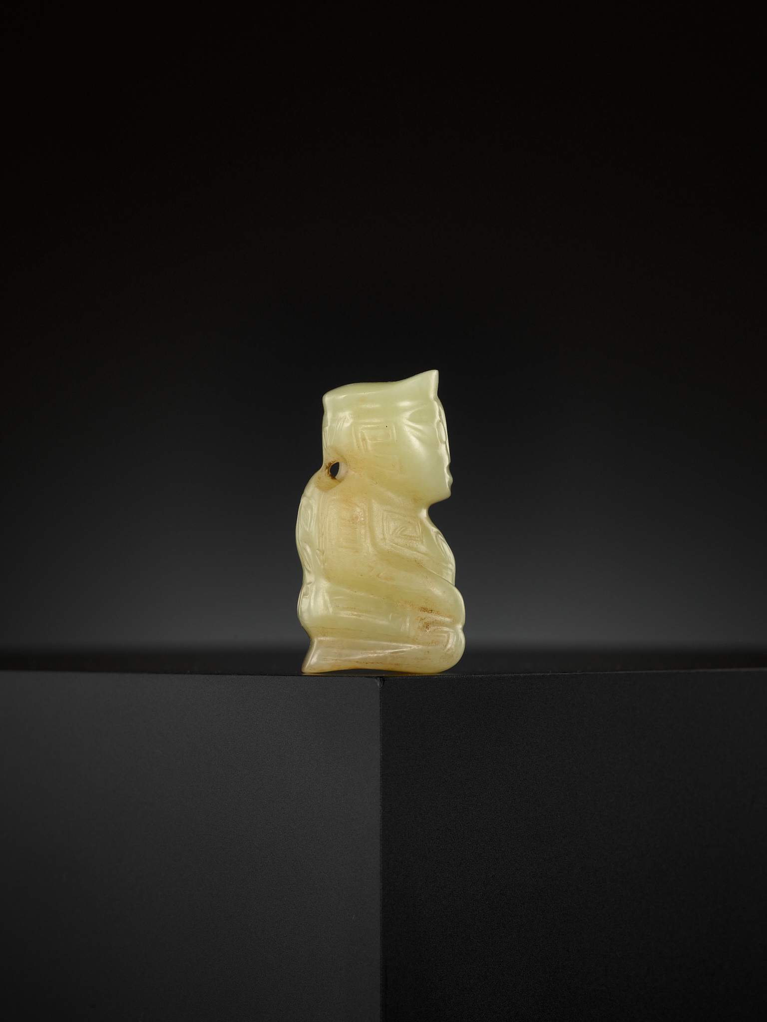 Lot 48 - AN EXTREMELY RARE YELLOW JADE ‘KNEELING