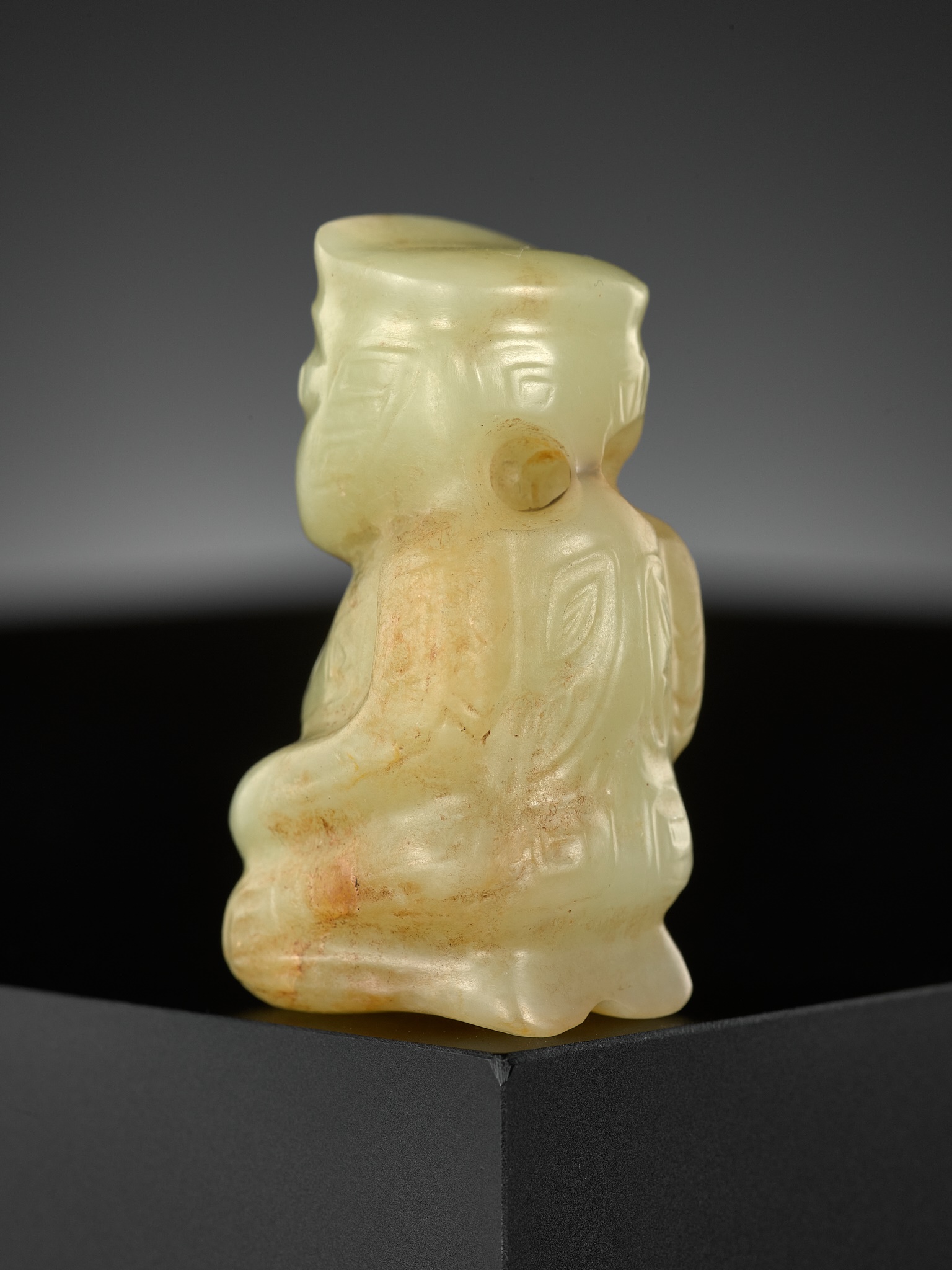 Lot 48 - AN EXTREMELY RARE YELLOW JADE ‘KNEELING