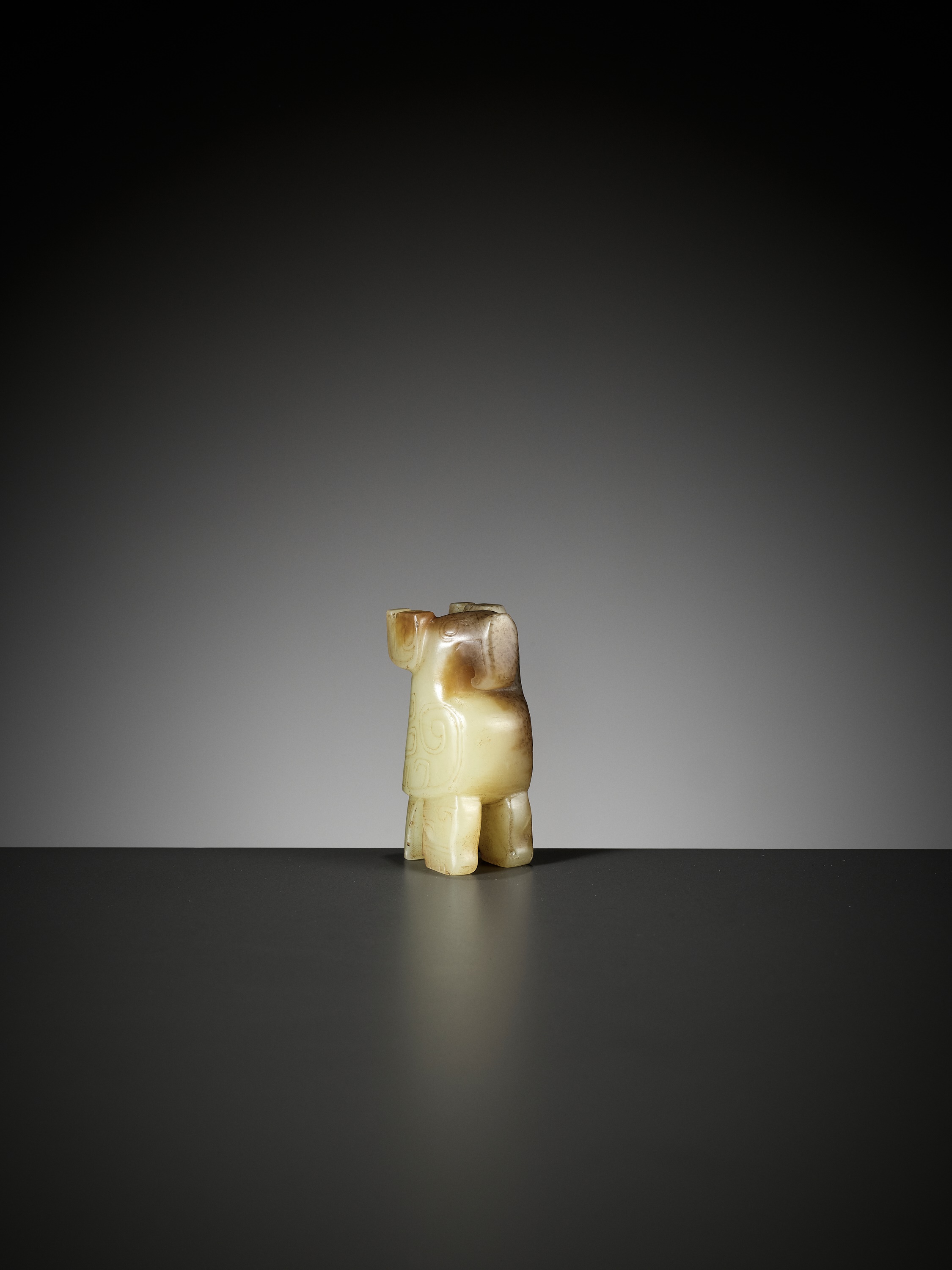 Lot 31 - AN IMPORTANT AND RARE CELADON JADE CARVING OF