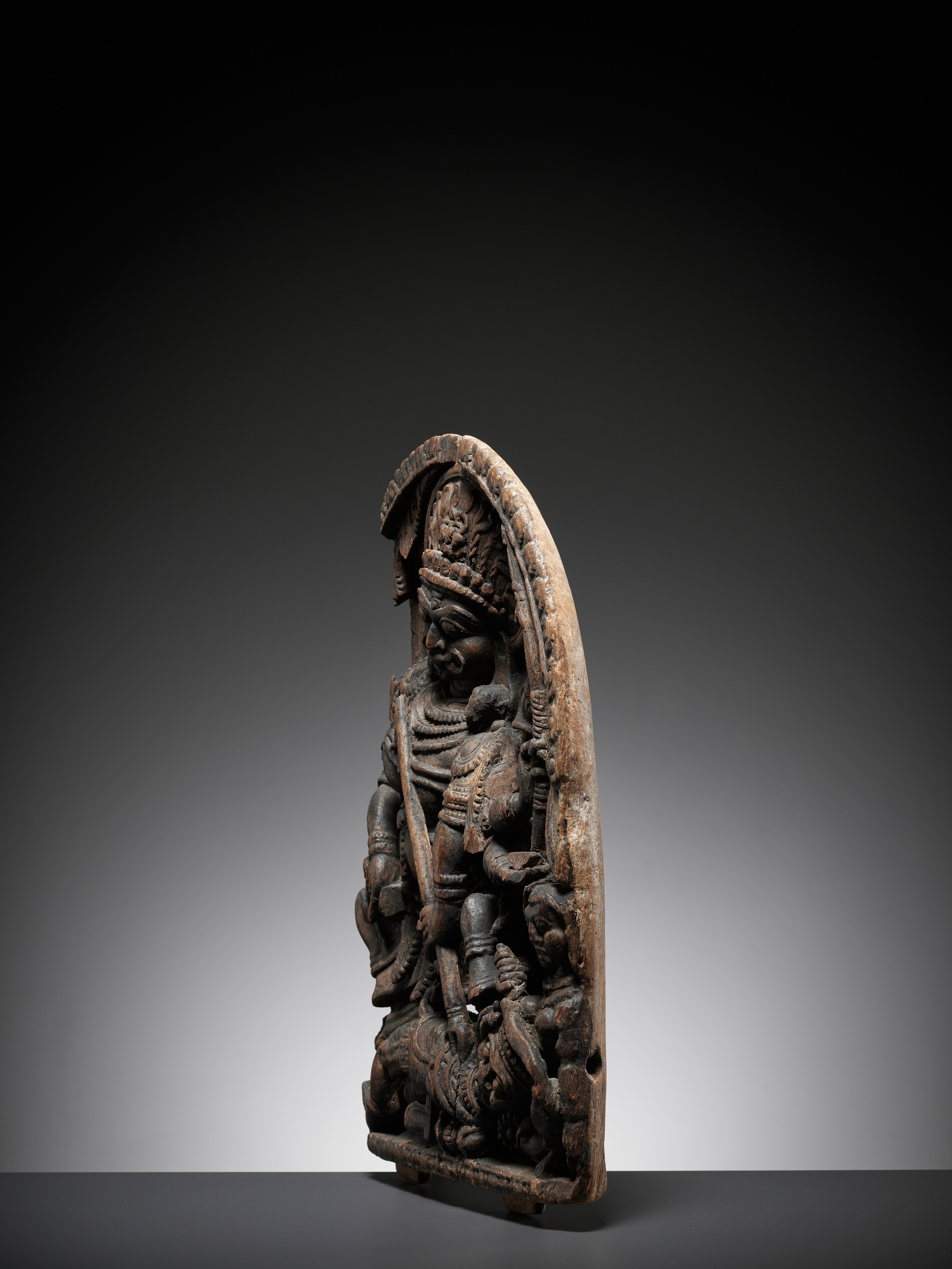 Lot 603 - A CARVED WOOD STELE DEPICTING SHIVA SLAYING