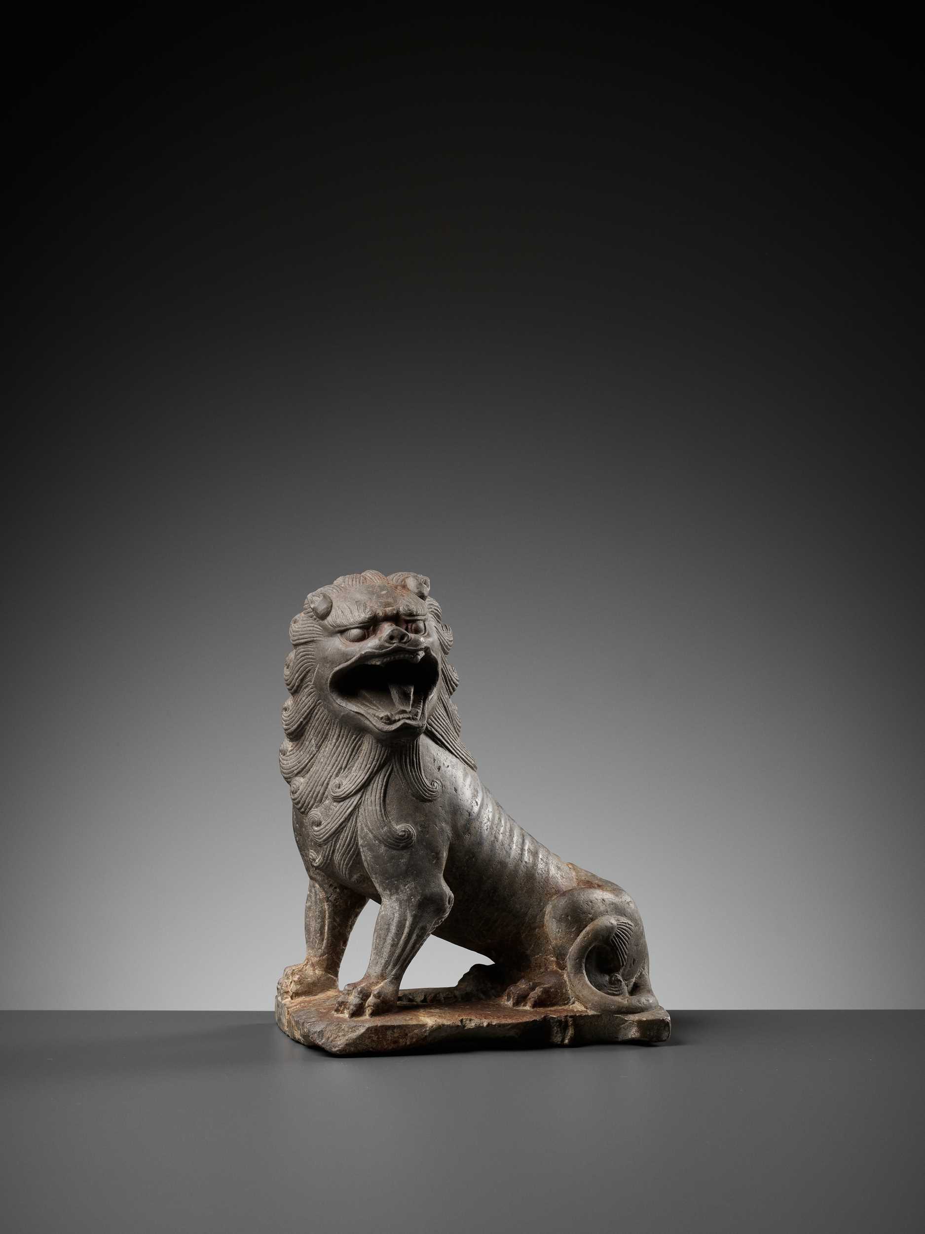 Lot 376 - A SUPERBLY CARVED LIMESTONE FIGURE OF A LION,