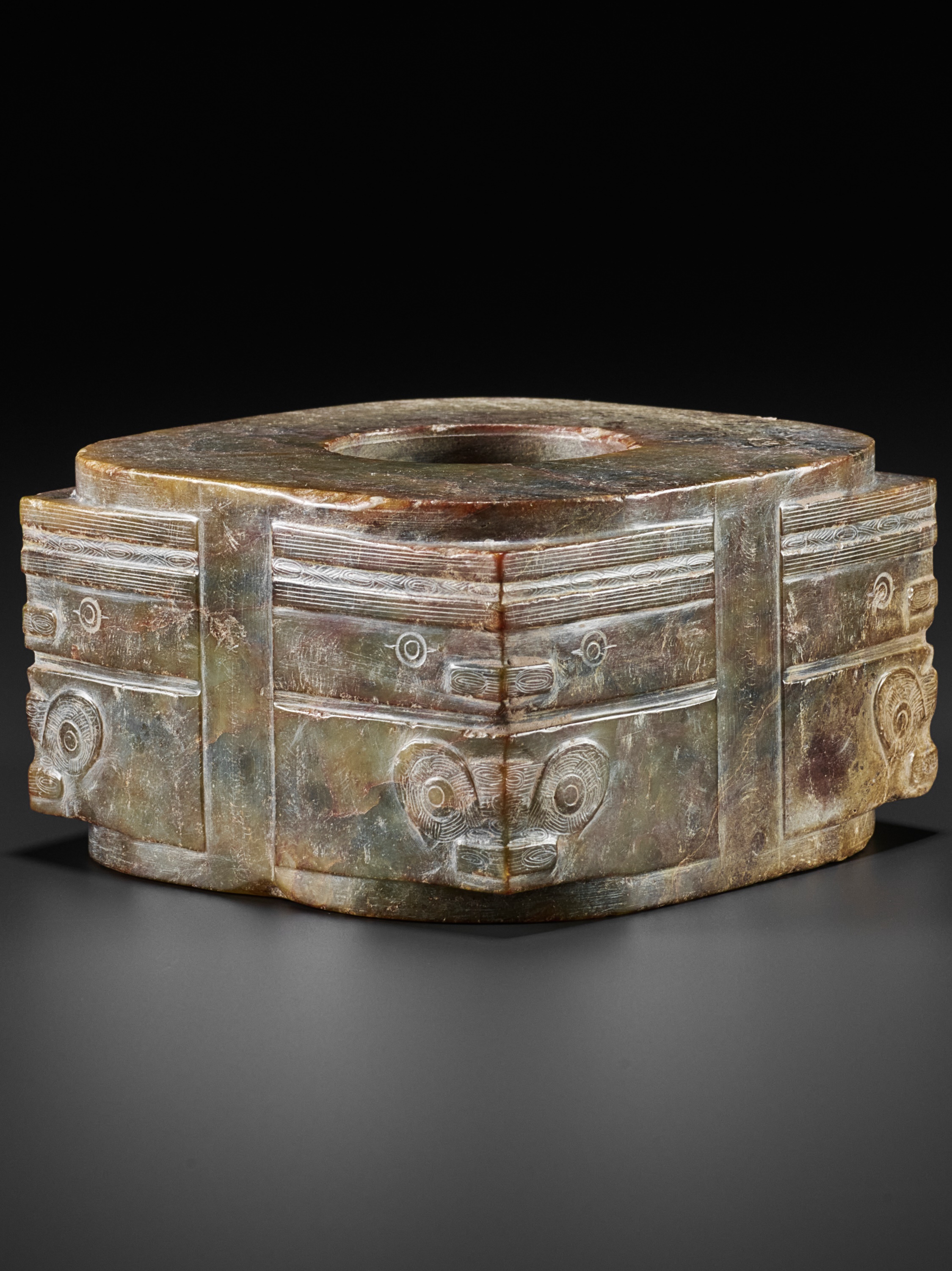 Lot 37 - A RARE AND MASSIVE MOTTLED JADE CONG,