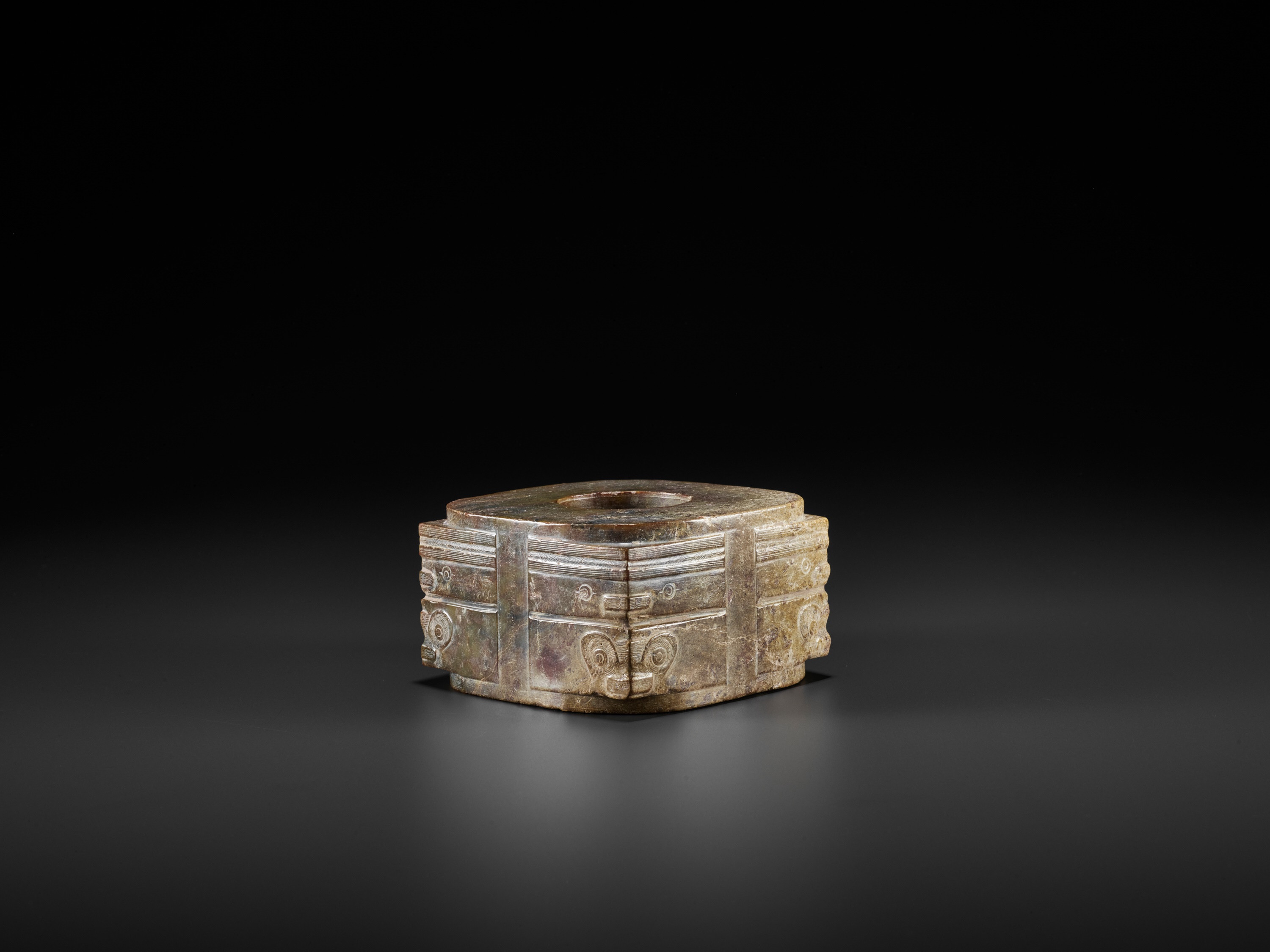 Lot 37 - A RARE AND MASSIVE MOTTLED JADE CONG,