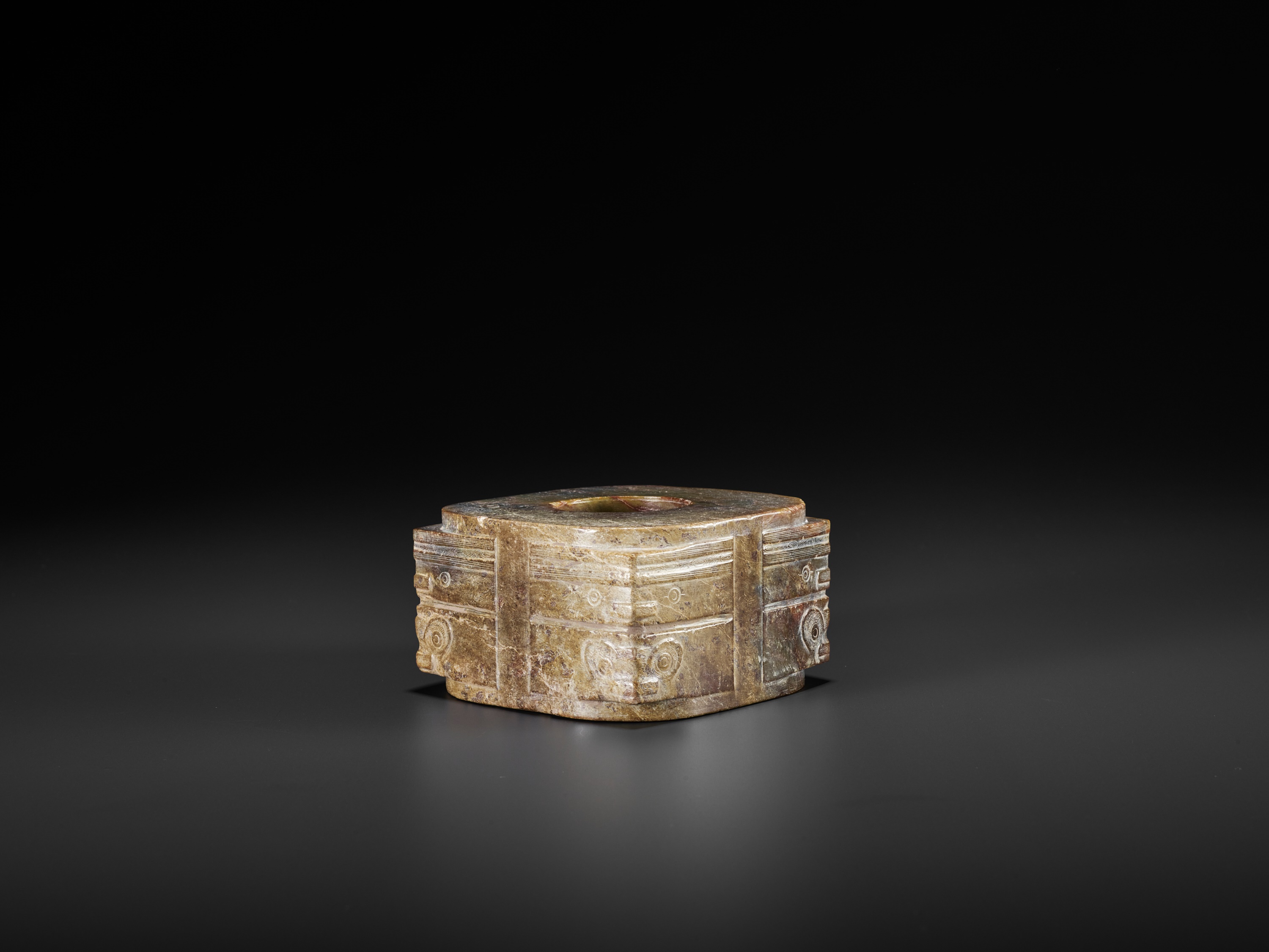 Lot 37 - A RARE AND MASSIVE MOTTLED JADE CONG,