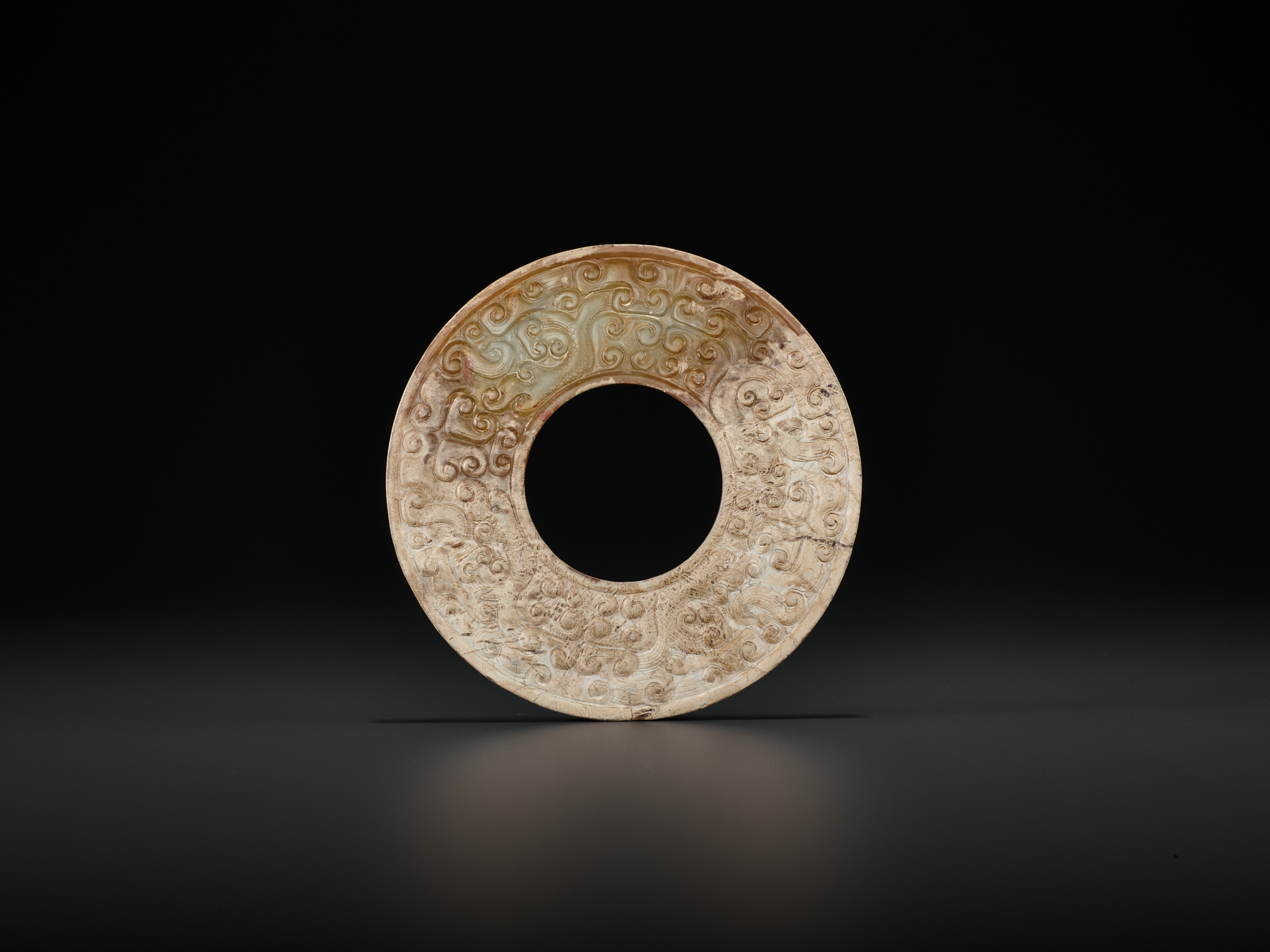 Lot 146 - A JADE DISC, HUAN, EASTERN ZHOU DYNASTY